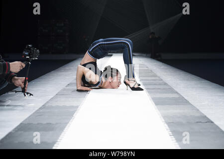 Chinese contortionist Liu Teng performs during an attempt to set a new ...