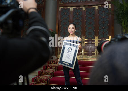 Chinese contortionist Liu Teng poses with a Guinness World Record ...