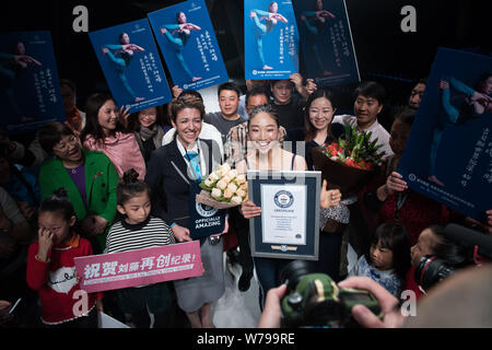 Chinese contortionist Liu Teng poses with a Guinness World Record ...