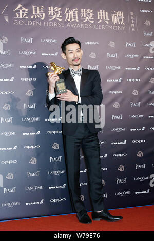 Taiwanese actor Chen Chu-sheng poses with his trophy of the Best ...