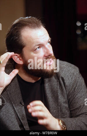 Latvian conductor Andris Nelsons, right, talks with Chinese TV host Cao ...