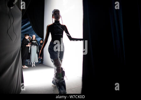 A model displays a new creation at the "Hui By Eran Hui" fashion show ...