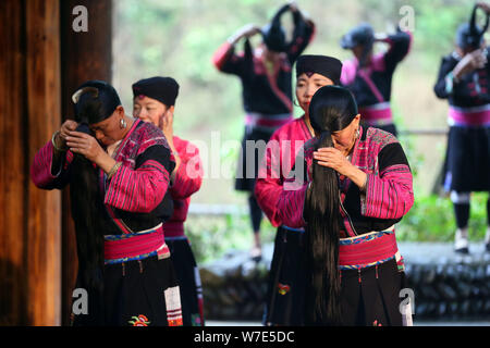 --FILE--Chinese women of Red Yao Ethnic Group dressed in traditional ...