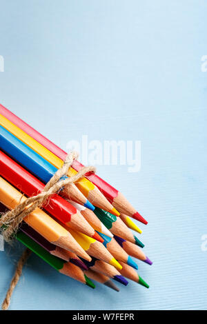 Pile of sharp coloured drawing pencils on table. 1 September concept ...