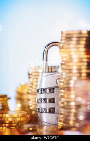 Silver combination lock with several stacks of coins | usage worldwide ...