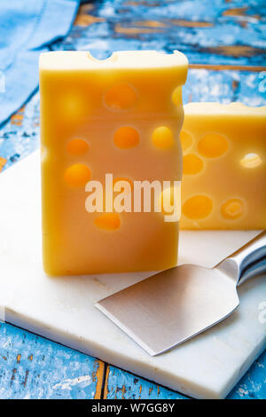 Two blocks of French emmental semi-hard cheese close up Stock Photo - Alamy