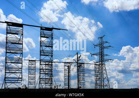 New power pole on the background of clouds Stock Photo - Alamy