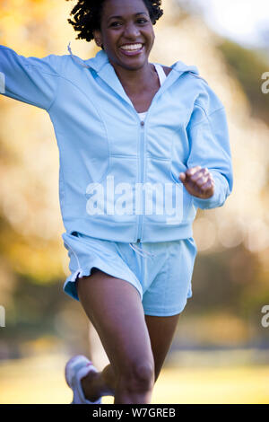woman running outside, leaping in the air Stock Photo - Alamy