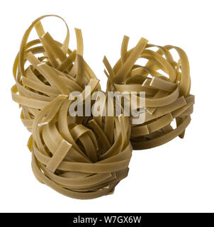 italian tagliatelle pasta nests on a white background - natural food ...