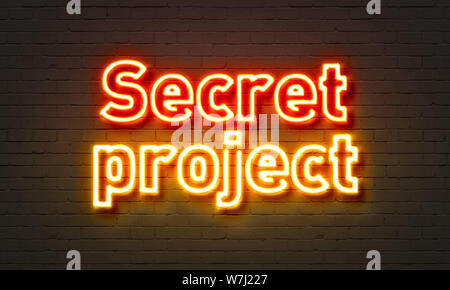 Top secret neon sign on brick wall background Stock Photo - Alamy