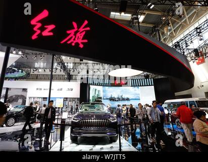 --FILE--Chinese visitors look at a Hongqi (Red Flag) concept SUV of FAW ...