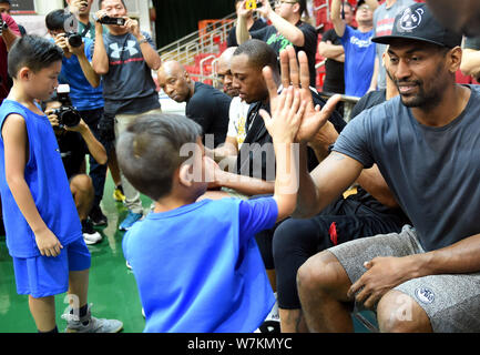NBA star Metta World Peace shows off his basketball skills to instruct ...