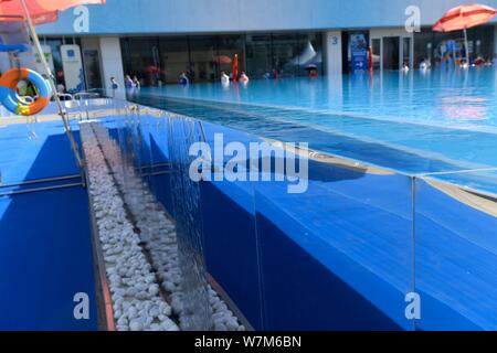 View of the 25 meters long and 15 meters wide infinity pool beside ...