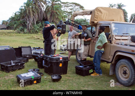 Simon Werry rigging Cineflex 'yogicam' in back of vehicle. Amboseli ...