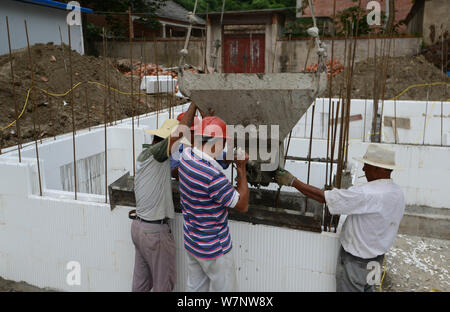 Chinese workers use expanded Polystyrene (EPS) foam to build houses in ...