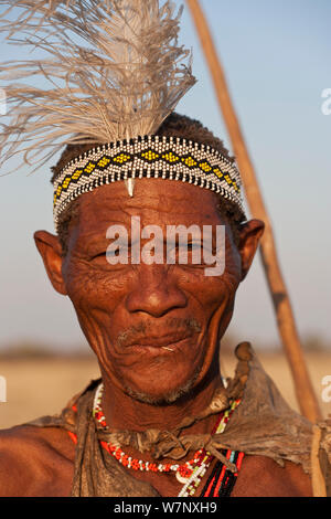 Portrait of a bushmen from the Kalahari desert with traditional weapons ...