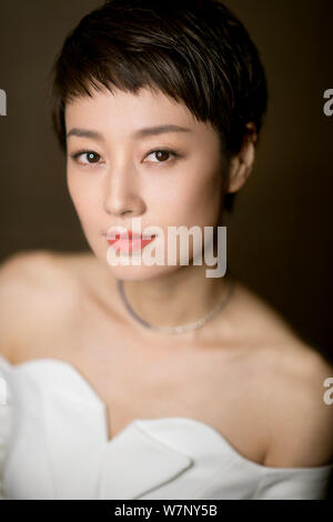 Chinese actress Ma Yili poses with her trophy for the Best Actress ...