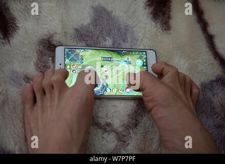 Chinese armless boy Peng Chao, left, makes live streaming webcast of ...