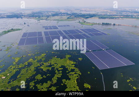 Aerial view of the world's largest floating solar energy plant with a ...