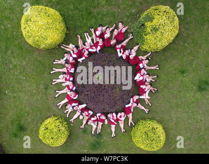 Female graduates of flight attendants major dressed in air hostess ...