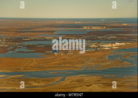 Aerial landscape view of Prudhoe Bay oil fields, central arctic coast ...