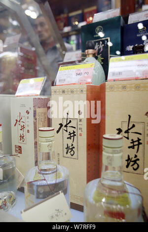 --FILE--Bottles of Chinese baijiu maker Jiang Xiao Bai are for sale in a supermarket in Shanghai ...