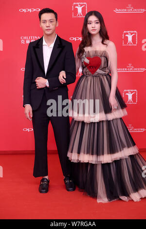 Chinese actress Lin Yun, right, and Hong Kong actor William Chan arrive ...