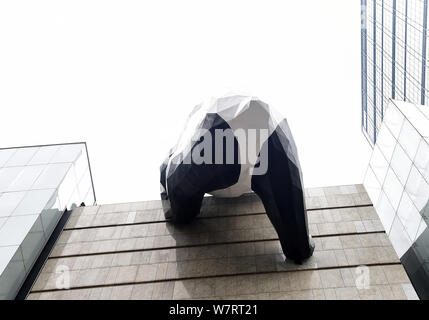 A giant panda sculpture climbs the building of the Chengdu ...