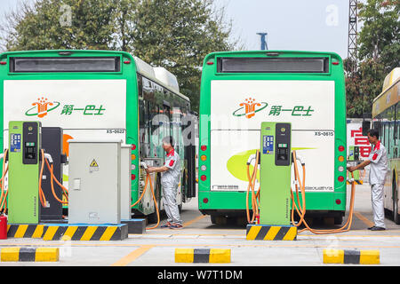 GUANGZHOU, GUANGDONG PROVINCE, CHINA - Buses and autos on road under ...