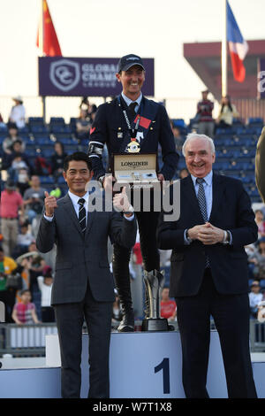 Italian equestrian Lorenzo de Luca, top, poses on the podium after ...