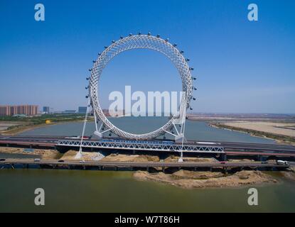 Aerial view of Bailang River Bridge Ferris Wheel, the world's first ...