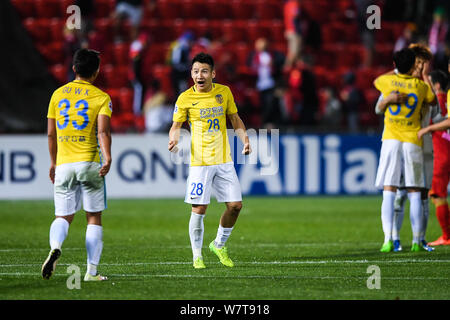 Players of Jiangsu Suning F.C. celebrate after scoring a goal against ...