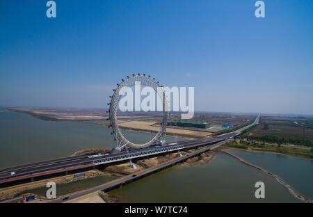 Aerial view of Bailang River Bridge Ferris Wheel, the world's first ...