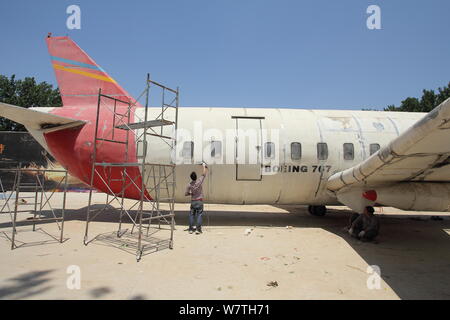 An old plane with "Boeing 767" and "QANTAS" on its fuselage is pictured ...
