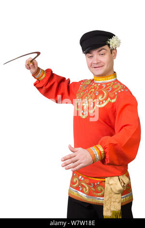 attractive russian guy with sickle in folk costume, studio picture ...