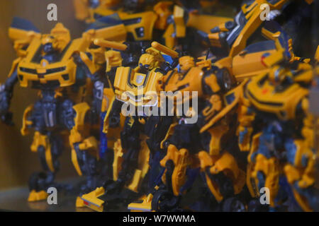 Chinese Transformers fan Wang Geng shows a poster of the movie ...