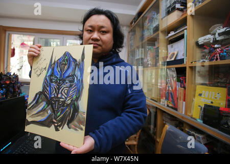 Chinese Transformers fan Wang Geng shows a painting of Optimus Prime ...