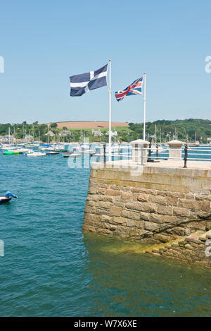 Cornish Saint Pirans and British Union Jack flags on pier at Falmouth ...