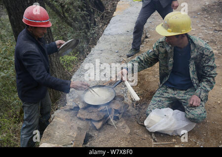 A Chinese villager cooks for team members when they use 10 mules to ...