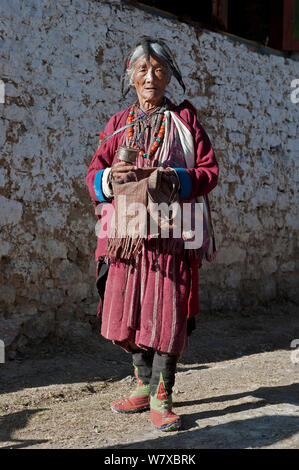 Old lady in traditional Mompa tribe dress (typical head dress made from ...