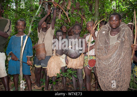 Mbuti Pygmy man, with bow and arrow. Arrows have iron tips and are used ...