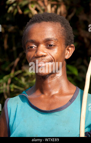 Mbuti Pygmy man, with bow and arrow. Arrows have iron tips and are used ...