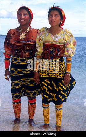 Kuna Indian woman wearing a traditional mola blouse, sews and ...