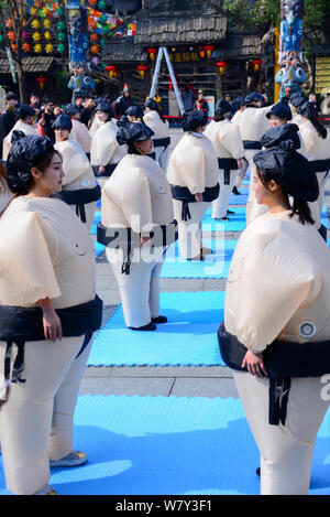 Chinese women dressed in inflatable sumo-wrestler costumes took part in ...