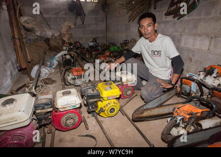 Sayan Raksachart of Freeland Foundation, with confiscated outboard ...