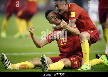 Yu Dabao, left, and Wang Yongpo of Chinese national men's football team ...