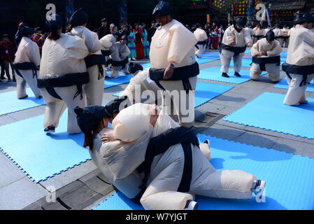 Chinese women dressed in inflatable sumo-wrestler costumes took part in ...