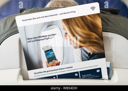 Lufthansa FlyNet plane wifi card in back of plane seat Stock Photo - Alamy