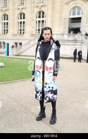Chinese model Wang Xinyu attends the Moncler Gamme Rouge Fashion Show ...