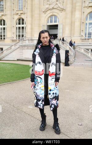 Chinese model Wang Xinyu attends the Moncler Gamme Rouge Fashion Show ...
